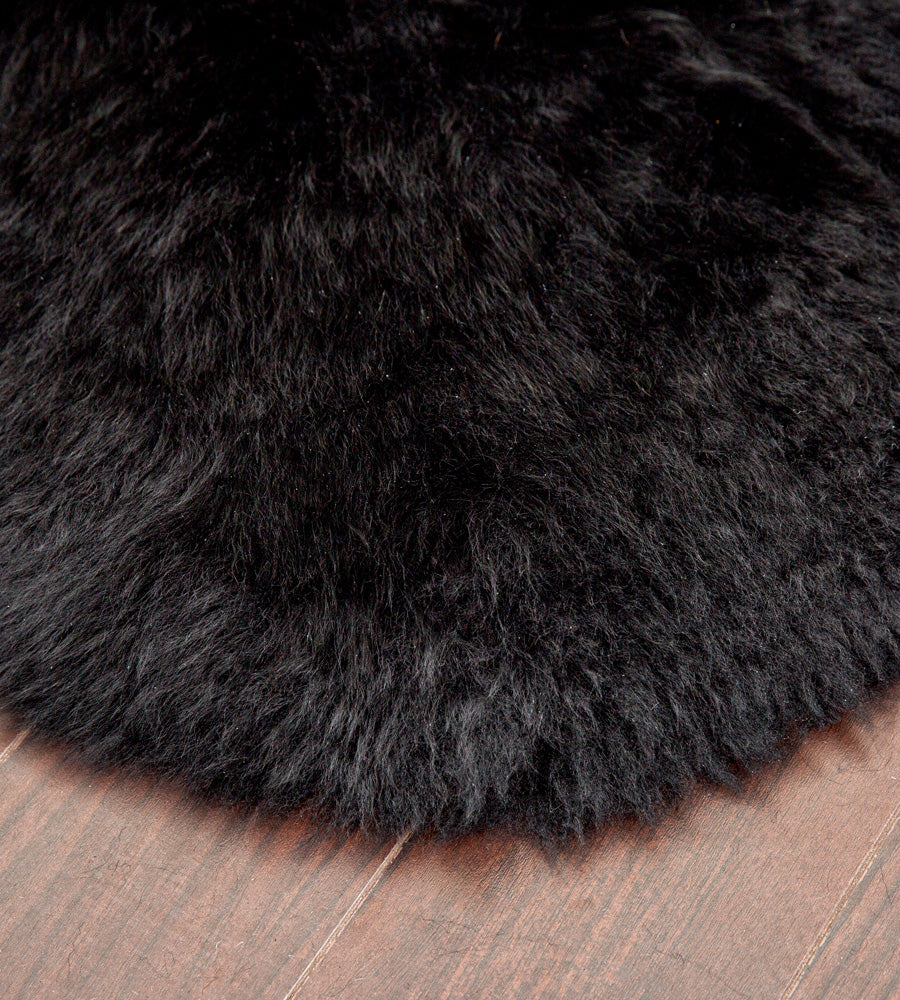 Quad Black Sheepskin | 4 Pelt Lambskin Rug (4 x 6.5ft) | SheepskinShop.com